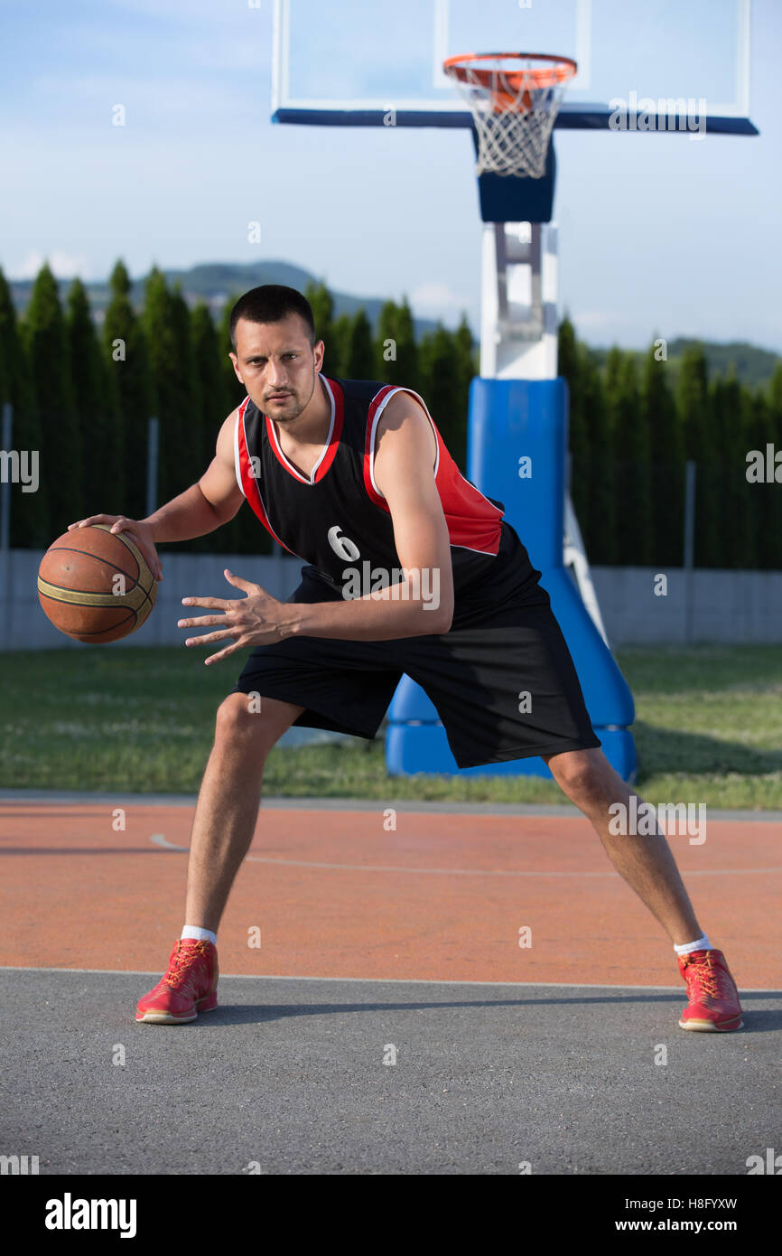 Portrait of young man street basket player Stock Photo - Alamy