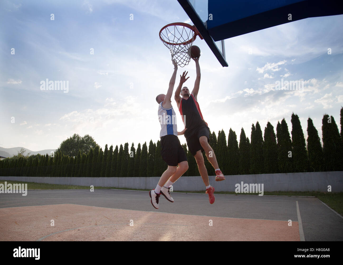 Two basketball players on the court outdoor Stock Photo - Alamy