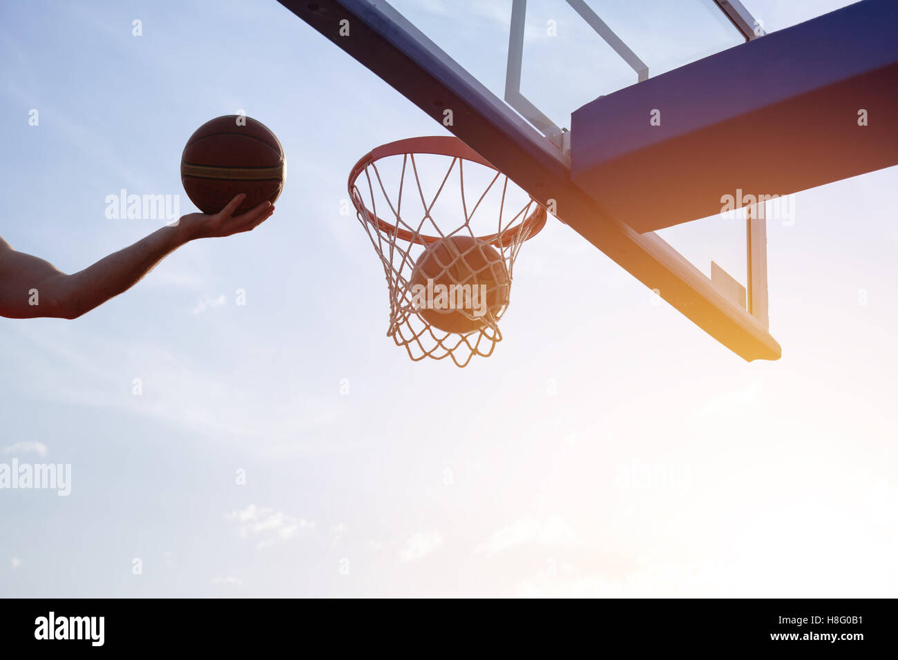 Basketball going through hoop hi-res stock photography and images - Alamy