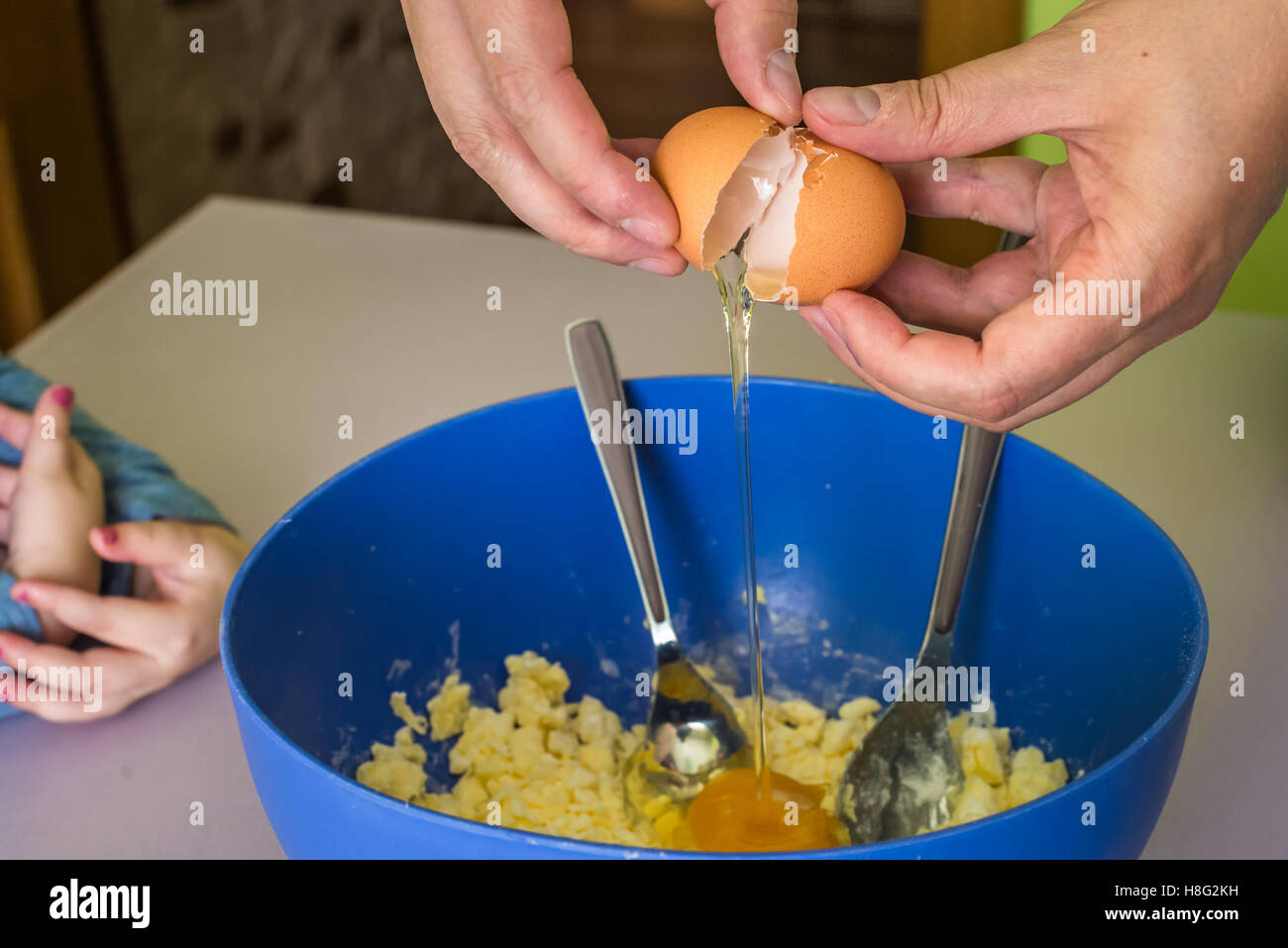 Professional chef pouring raw egg hi-res stock photography and images ...
