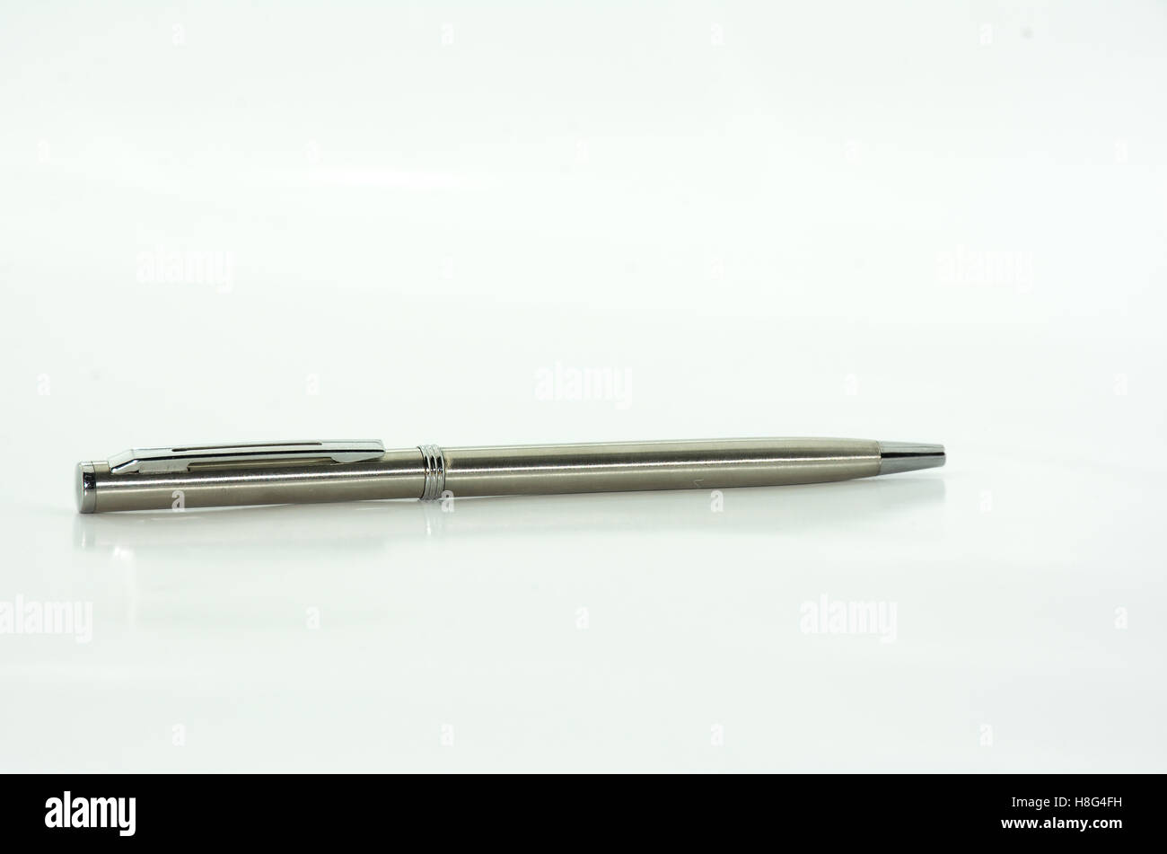 Close up of silver ballpoint pen on white background Stock Photo - Alamy