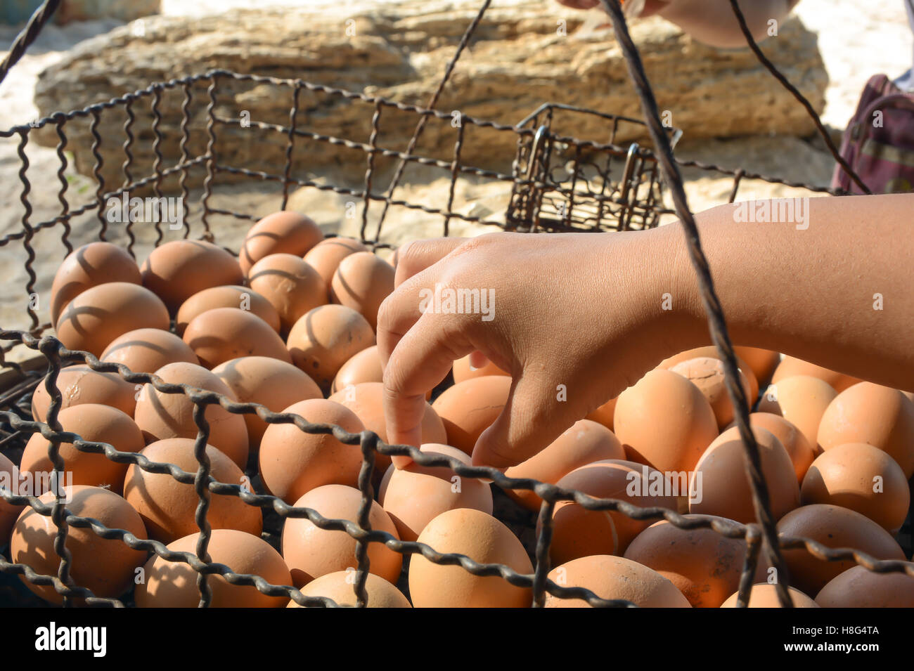 Close up hand picking up eggs toast on the stove Stock Photo - Alamy