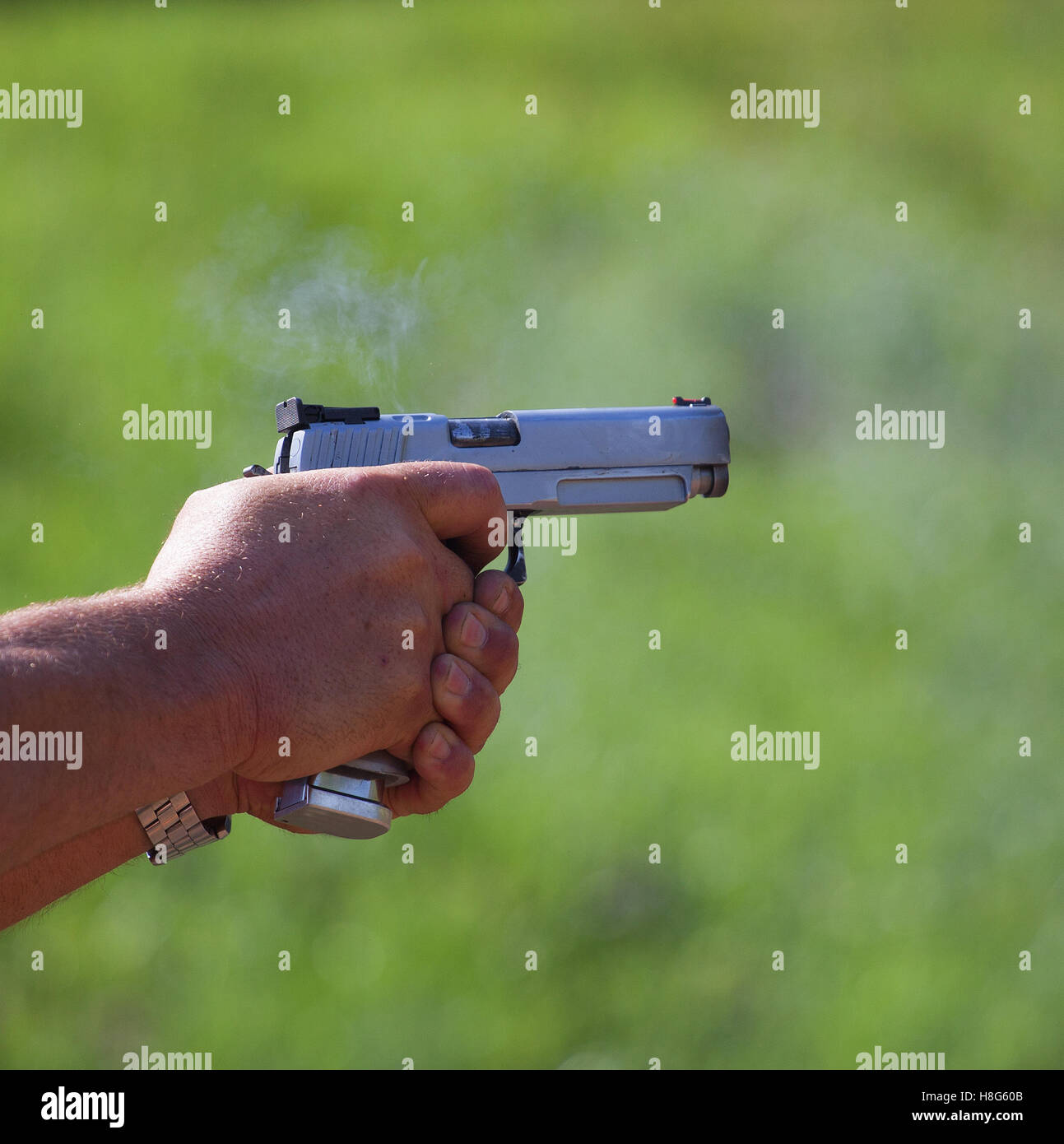 Handgun being fired hi-res stock photography and images - Alamy