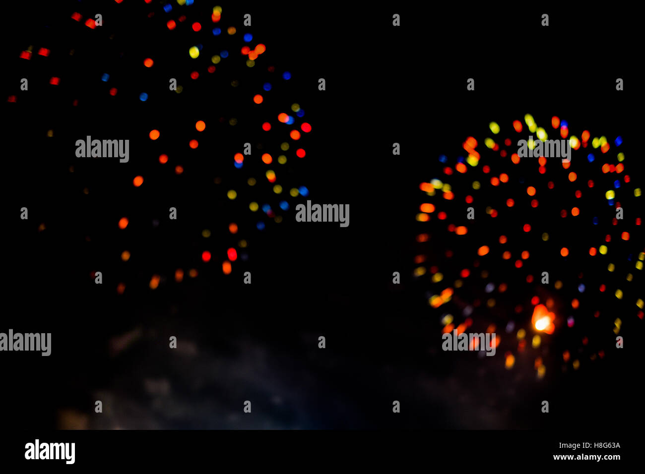 Festive colour firework background at a dark night Stock Photo - Alamy