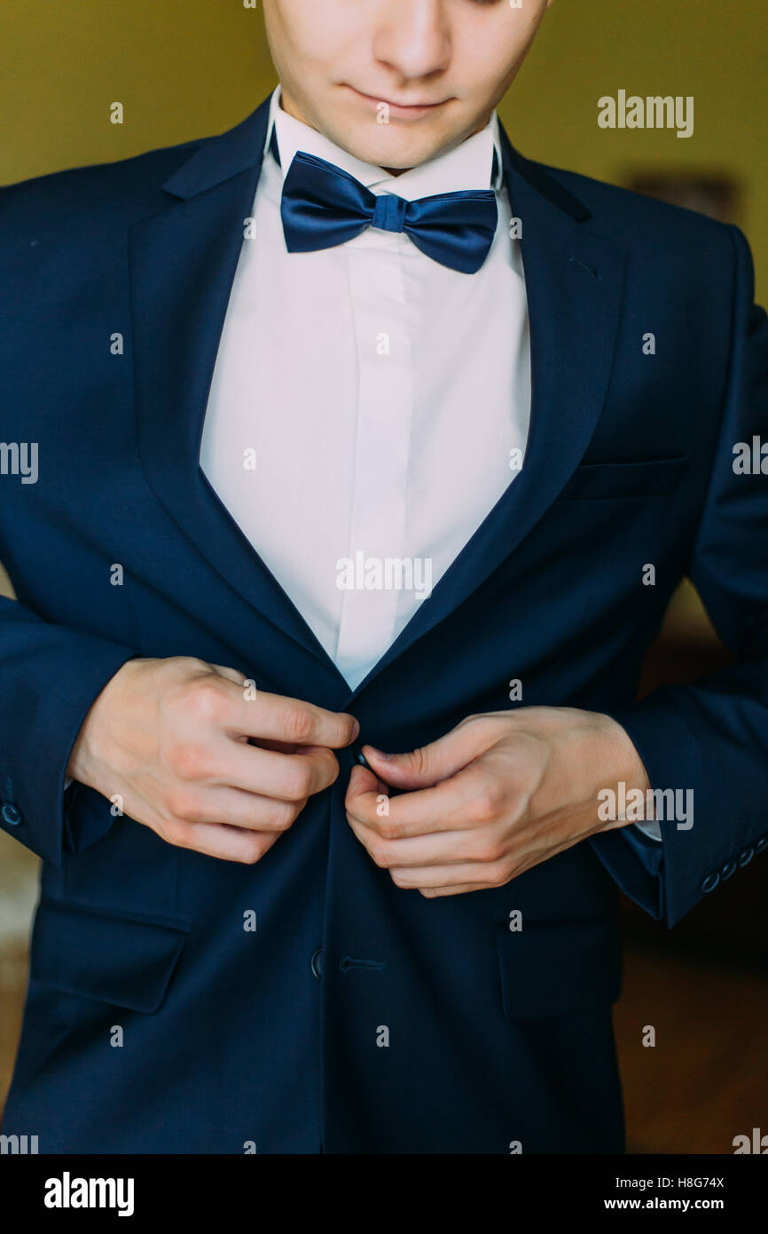 Stylish groom buttons on the elegant blue suit jacket close up Stock ...