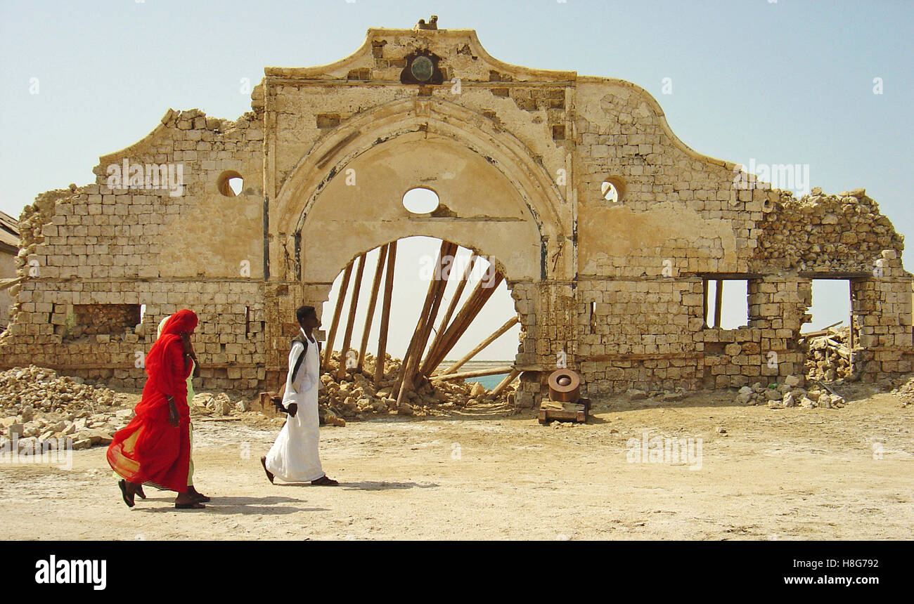 15th September 2005 People walk past a large derelict building in the ...