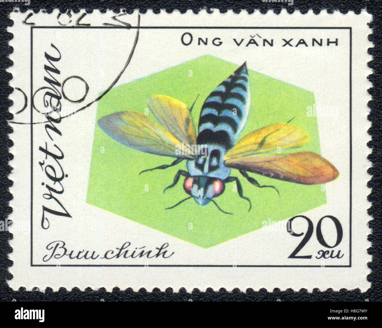 A postage stamp printed in Vietnam shows flying insect Aculeata , circa ...