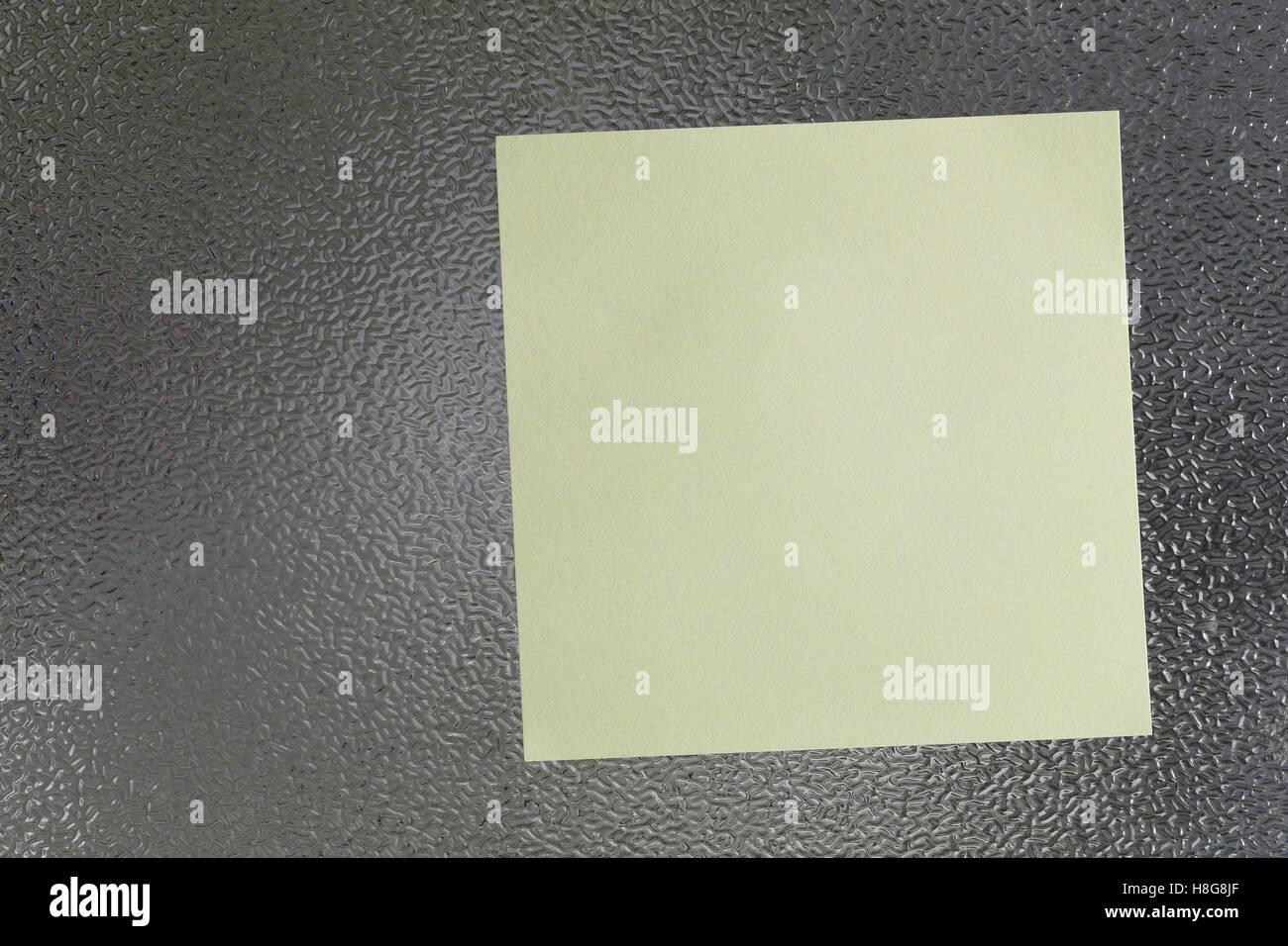 yellow of Note paper placed on glass floor,Design ideas can be Entered ...