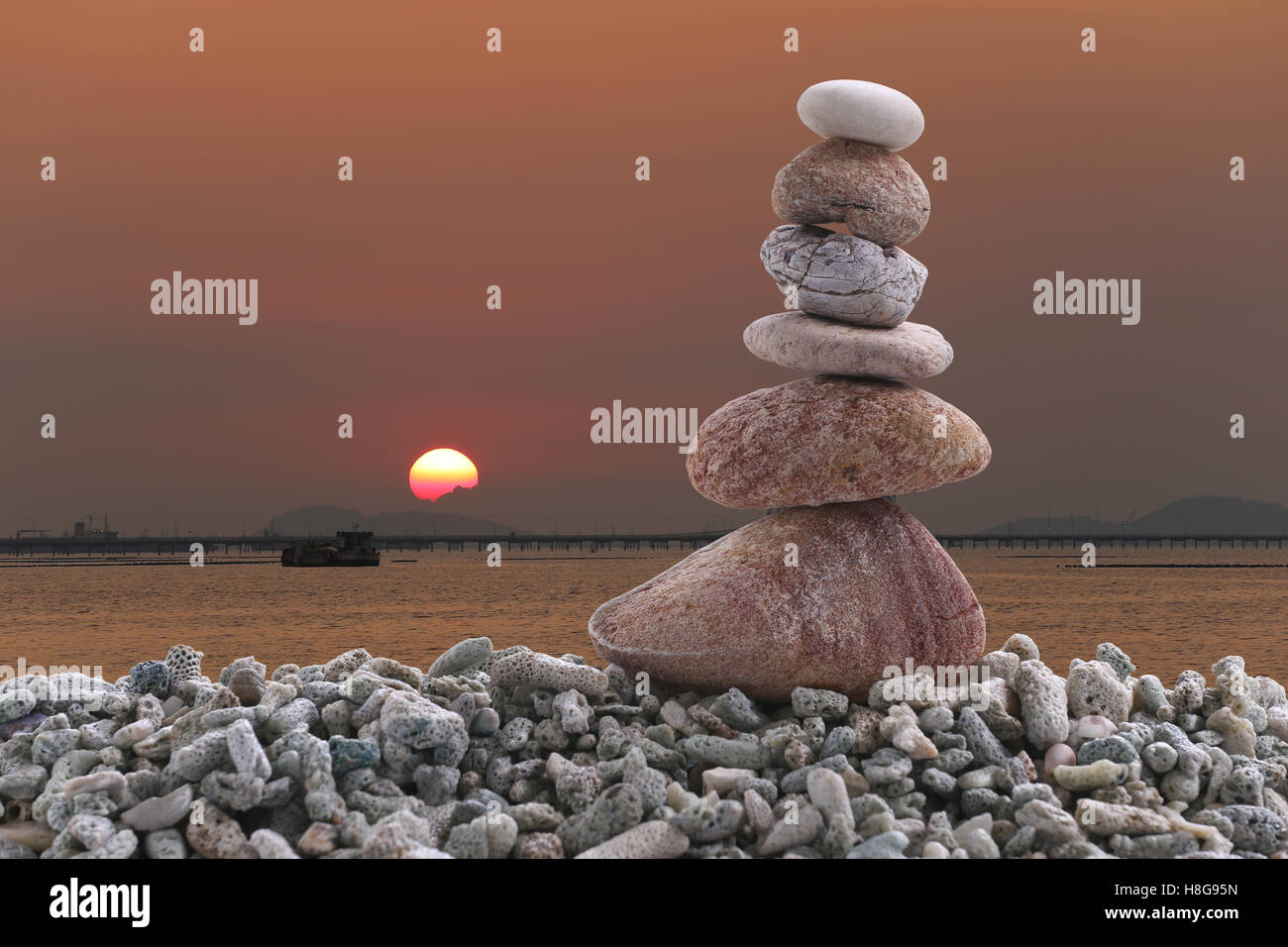 Balance stone on pile rock of sunset background in the evening,concept ...