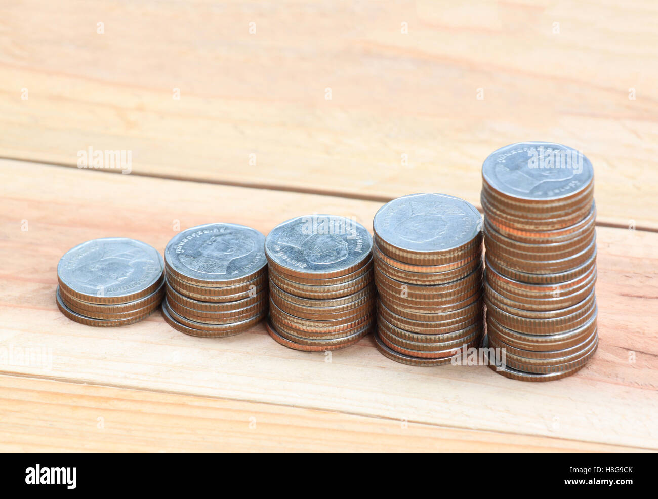 silver coin stack in business growth concept on wood floor Stock Photo ...