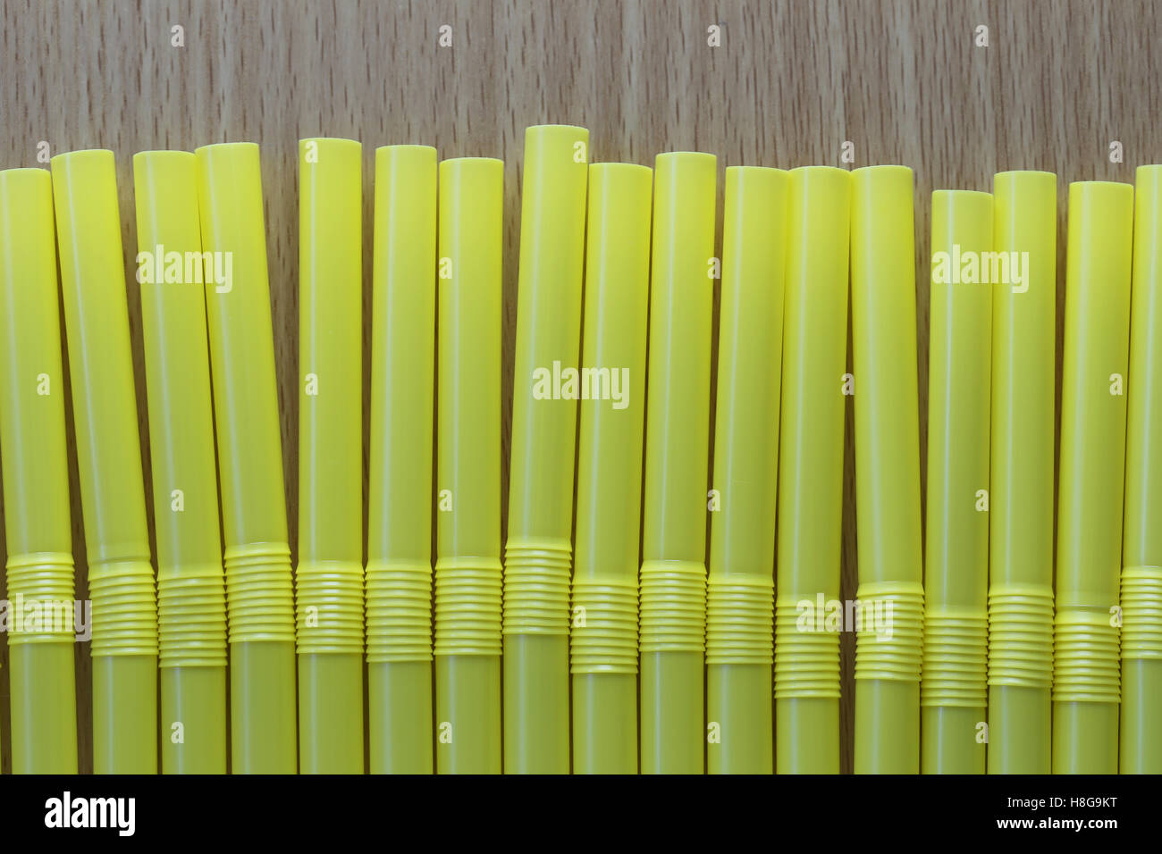 Drink tube of yellow color in abstract background for the design idea ...