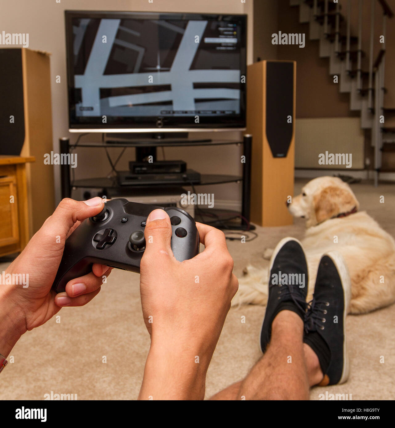 Family watching tv playing online hi-res stock photography and images ...