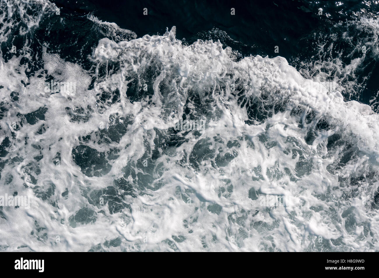 Background of waves and foam from moving boat Stock Photo - Alamy