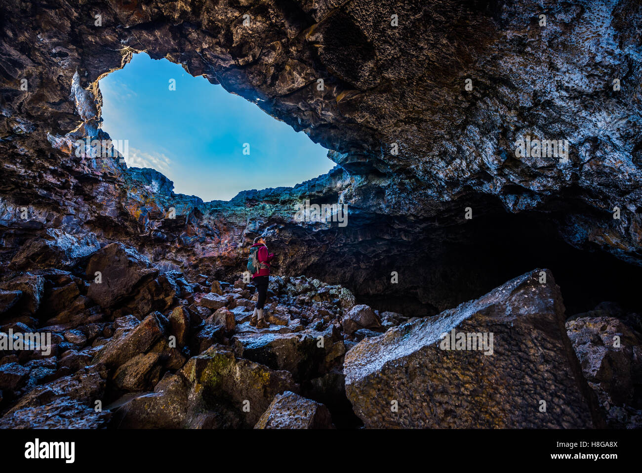 Lava Tubes Young Woman exploring Indian Tunnel Cave Crater of the Moon ...