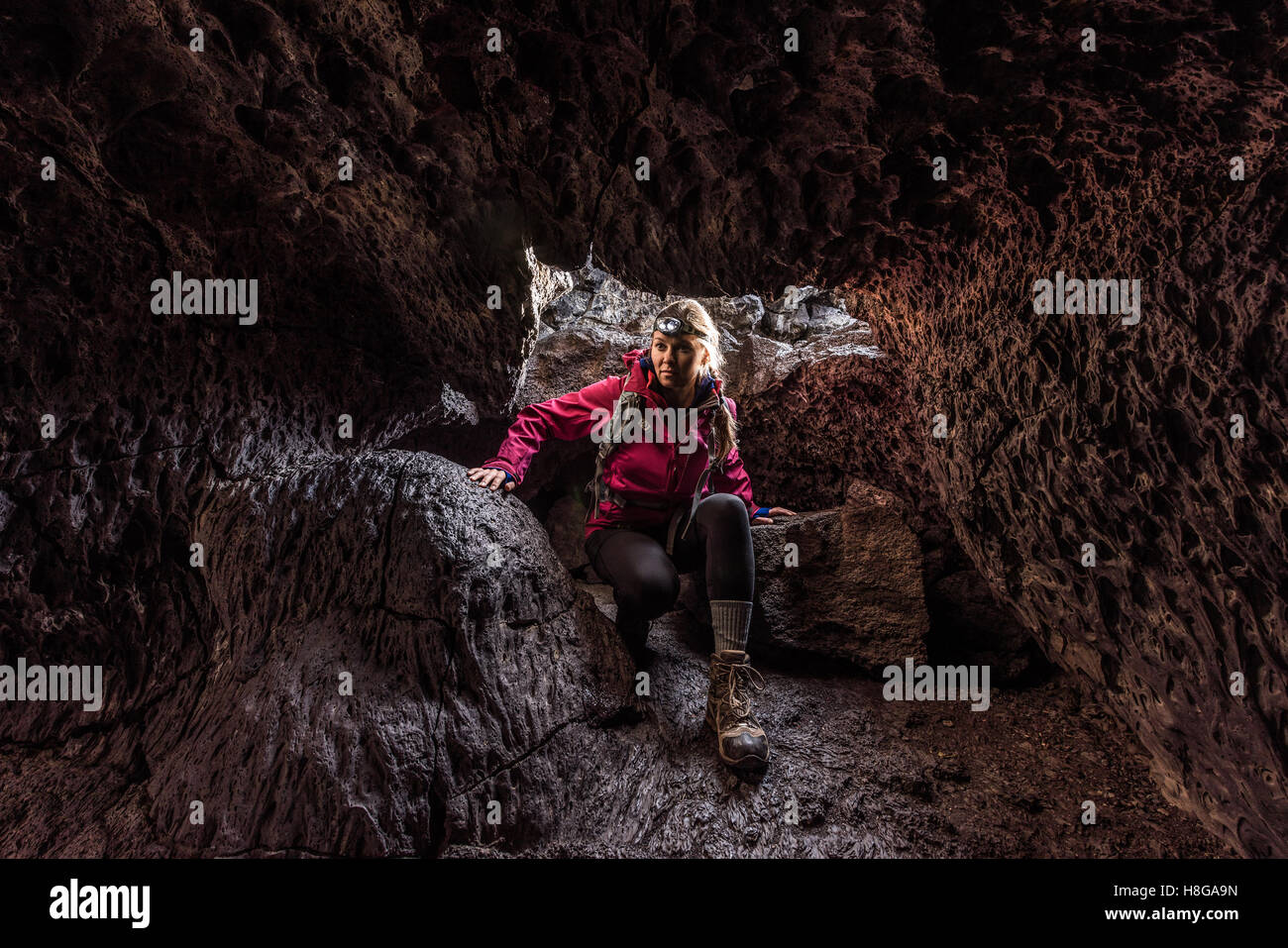 Girl entering Volcanic Cave Indian Tunnel Crater of the Moon Idaho ...