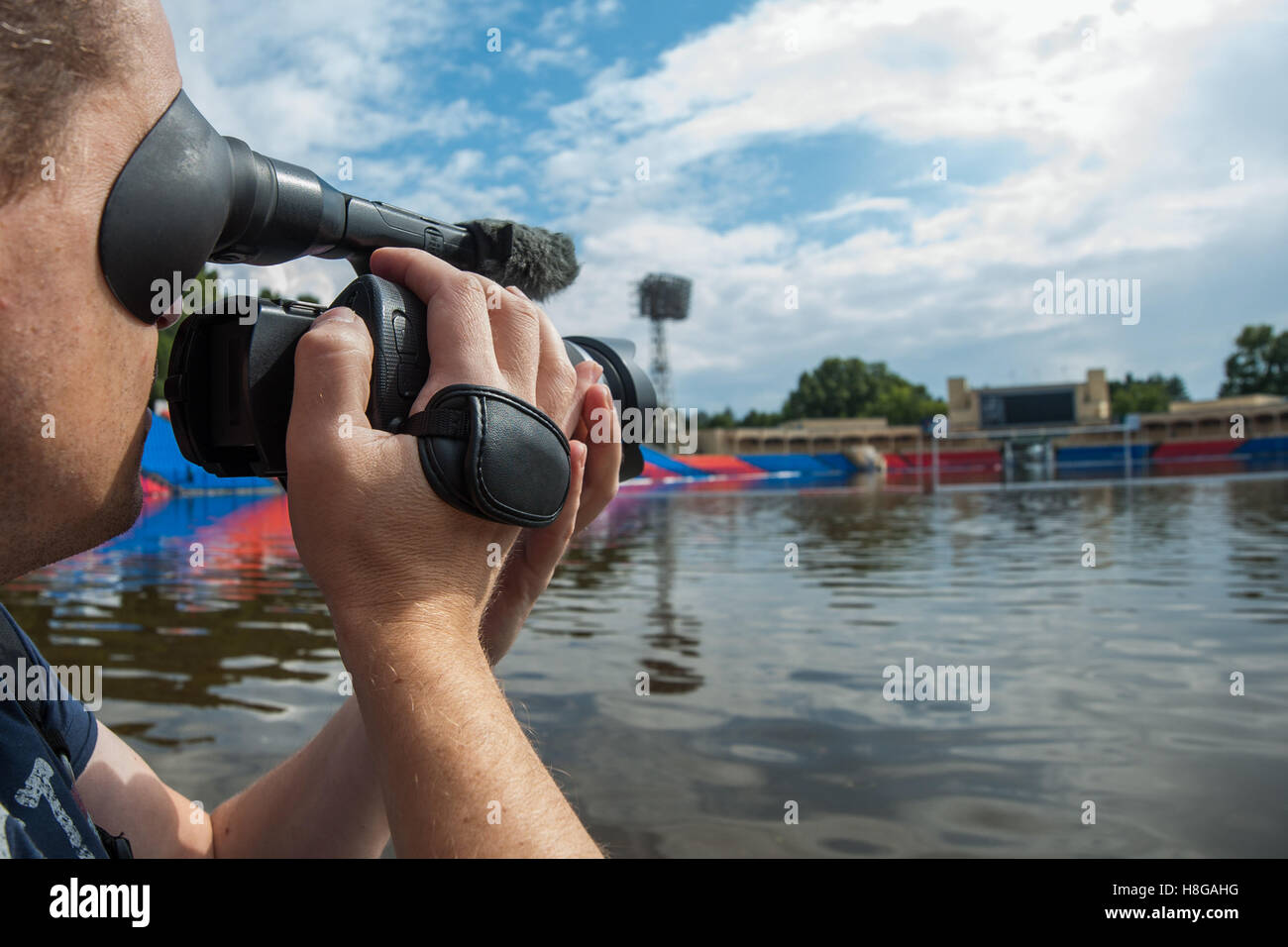 Cameraman at work. Shallow dof effect Stock Photo - Alamy