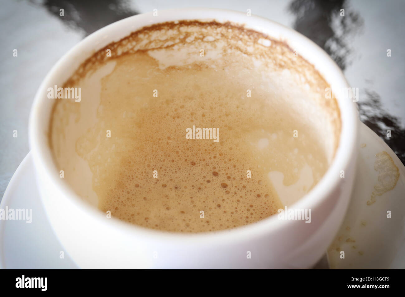 White coffee mug with coffee stains on table in a cafe Stock Photo - Alamy