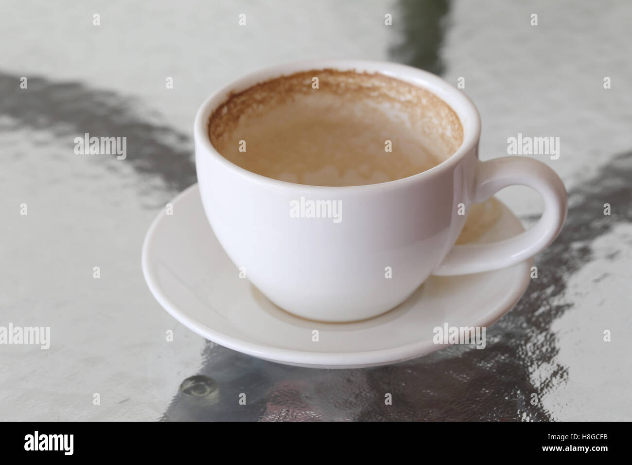 White coffee mug with coffee stains on table in a cafe Stock Photo - Alamy