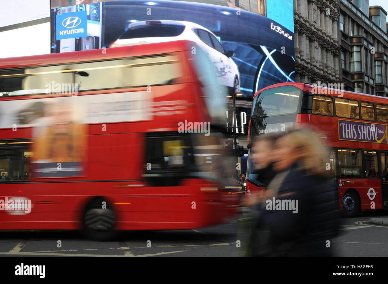 Red London bus in Piccadilly Circus Stock Photo - Alamy