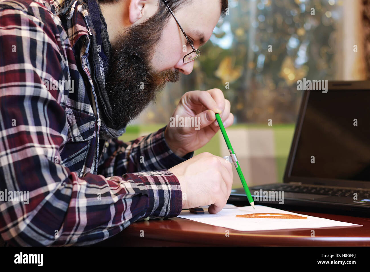 male notebook work bearded Stock Photo - Alamy