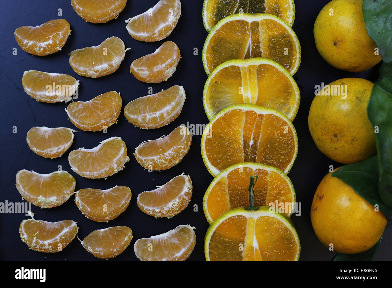 mandarin fruit isolate black Stock Photo - Alamy