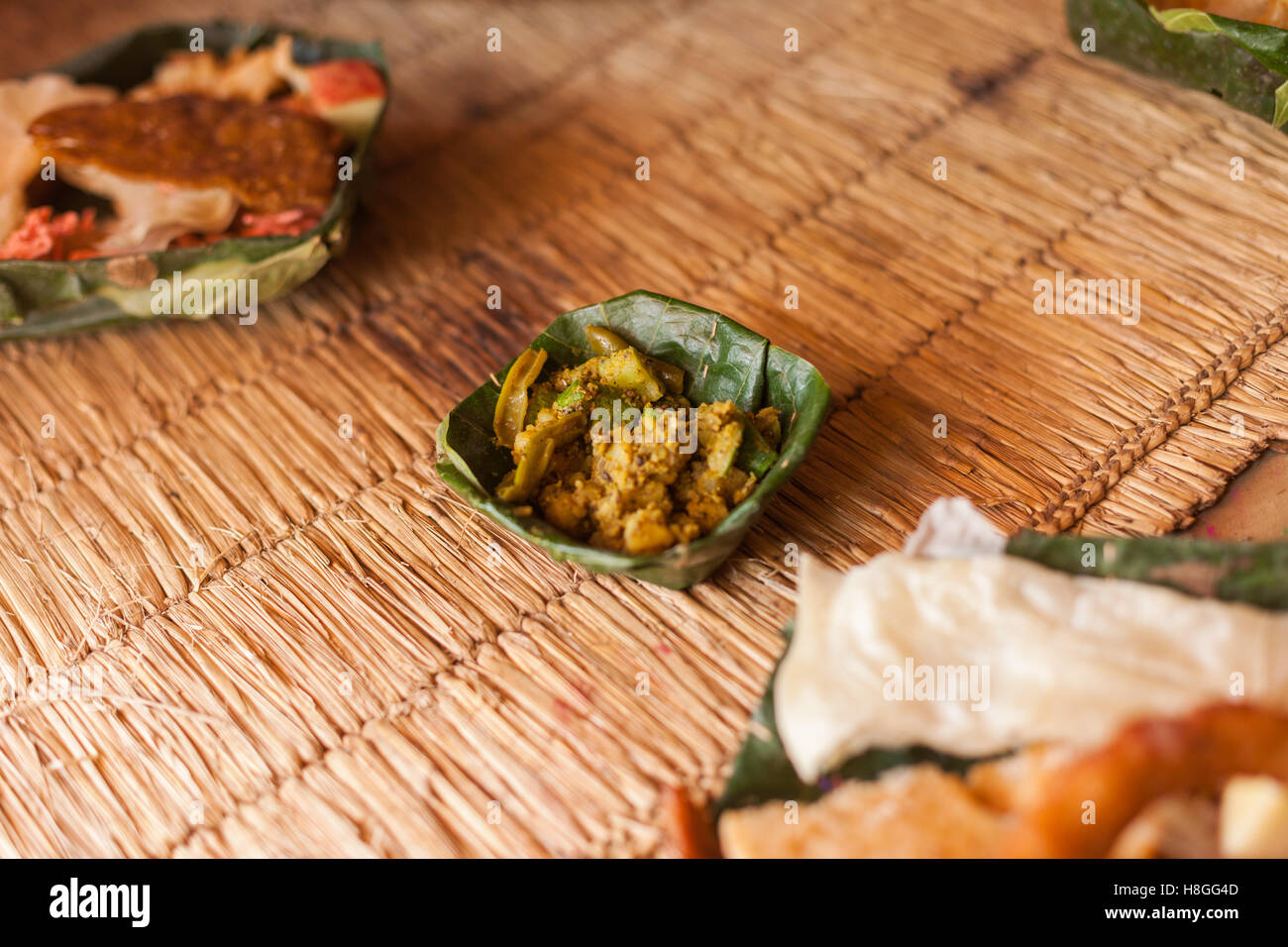 Pickle (achar) and tarkari (vegetables) in tapari (leaf plates Stock ...