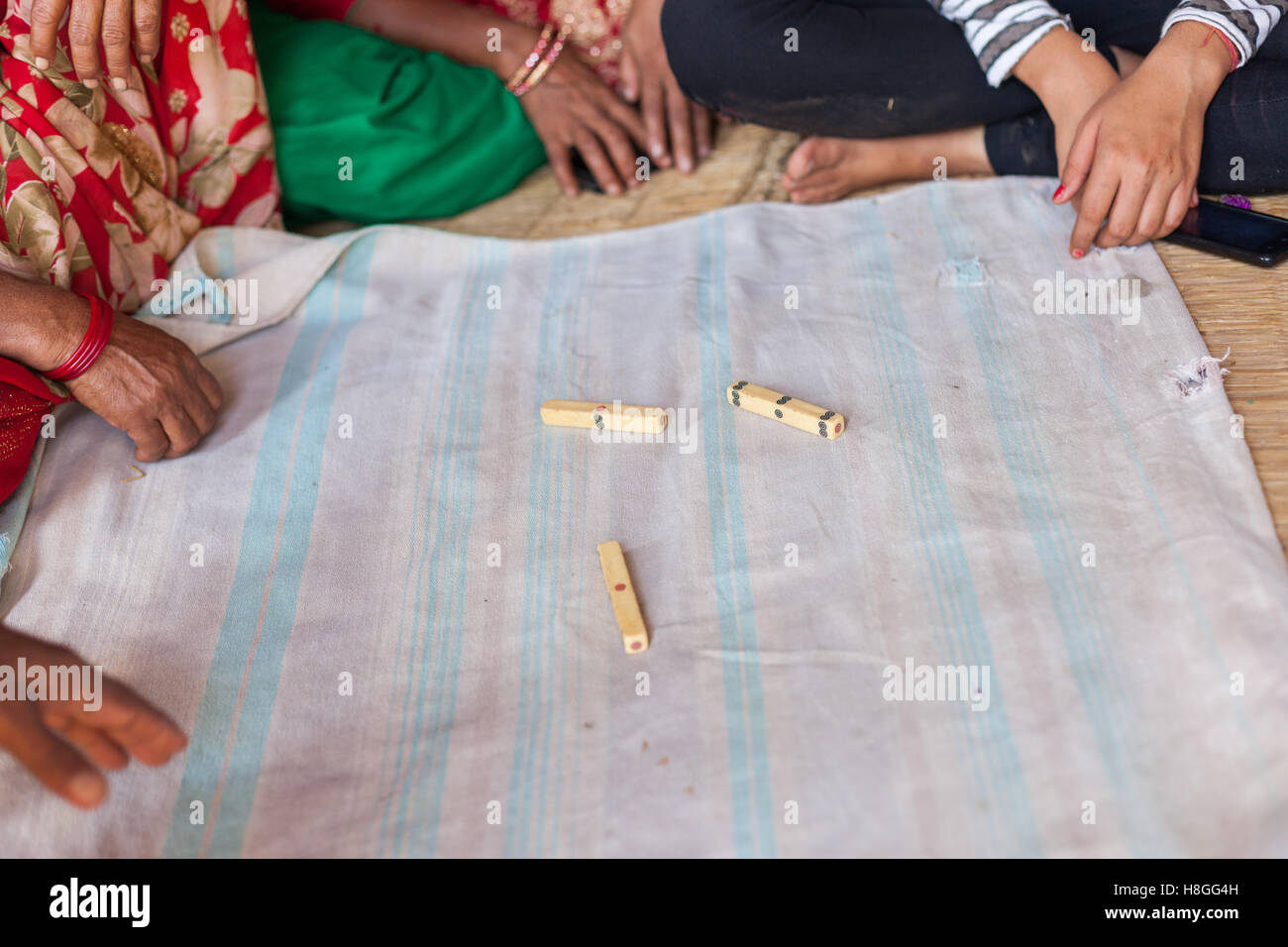 Playing Pasa dice in rural Nepal Stock Photo - Alamy