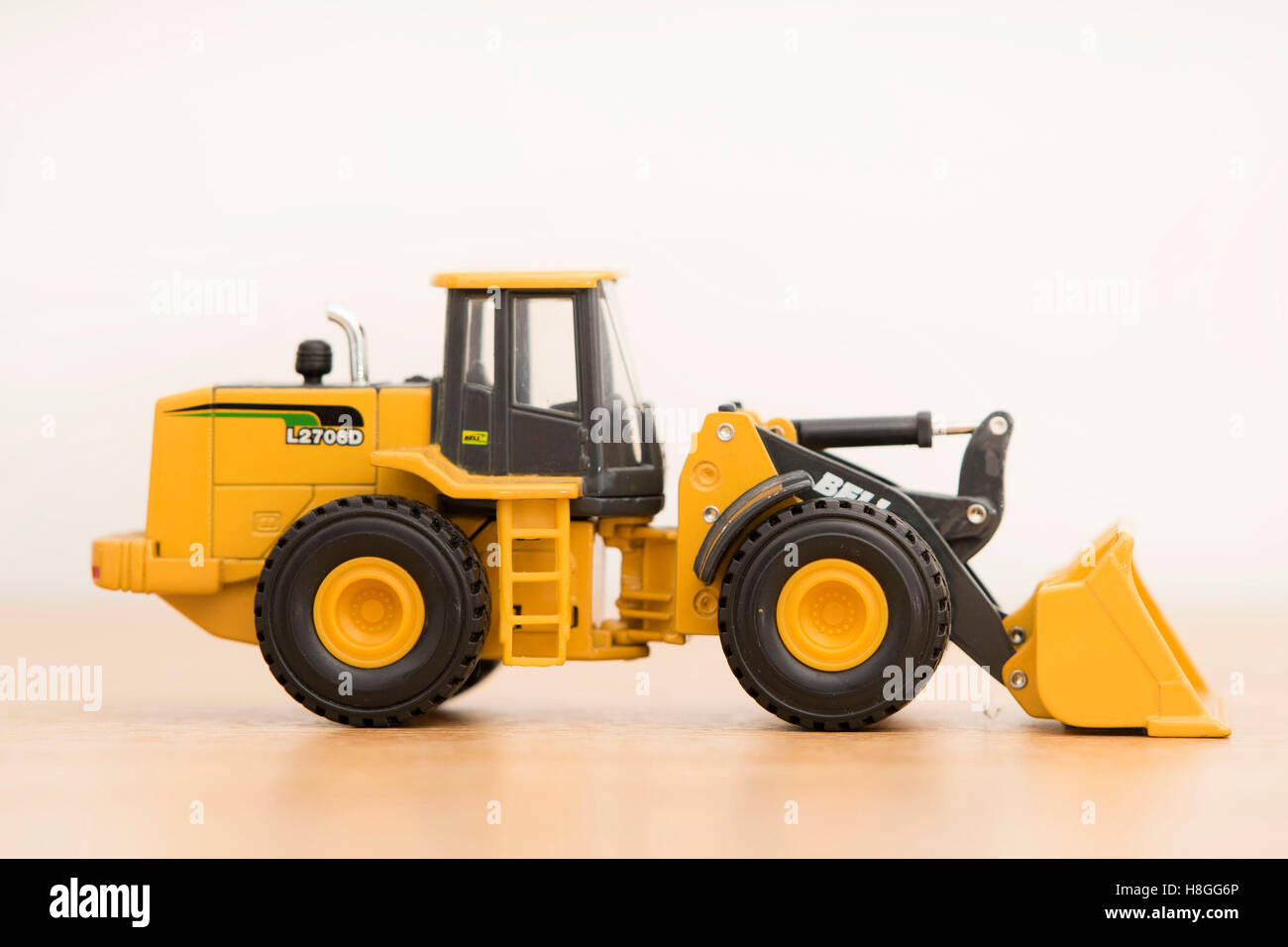 A small plastic toy digger Stock Photo - Alamy