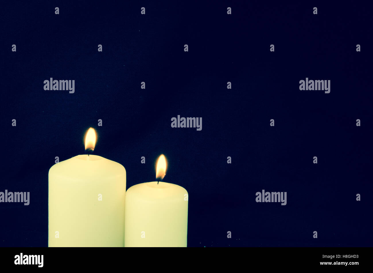 two white burning candles decoration Stock Photo - Alamy