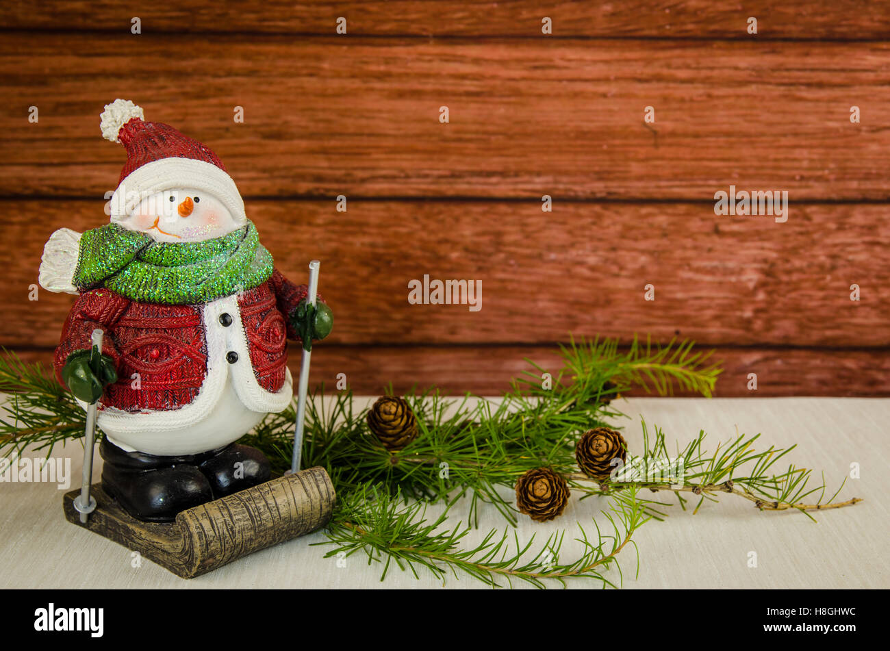 snowman and coniferous tree limb image Stock Photo - Alamy