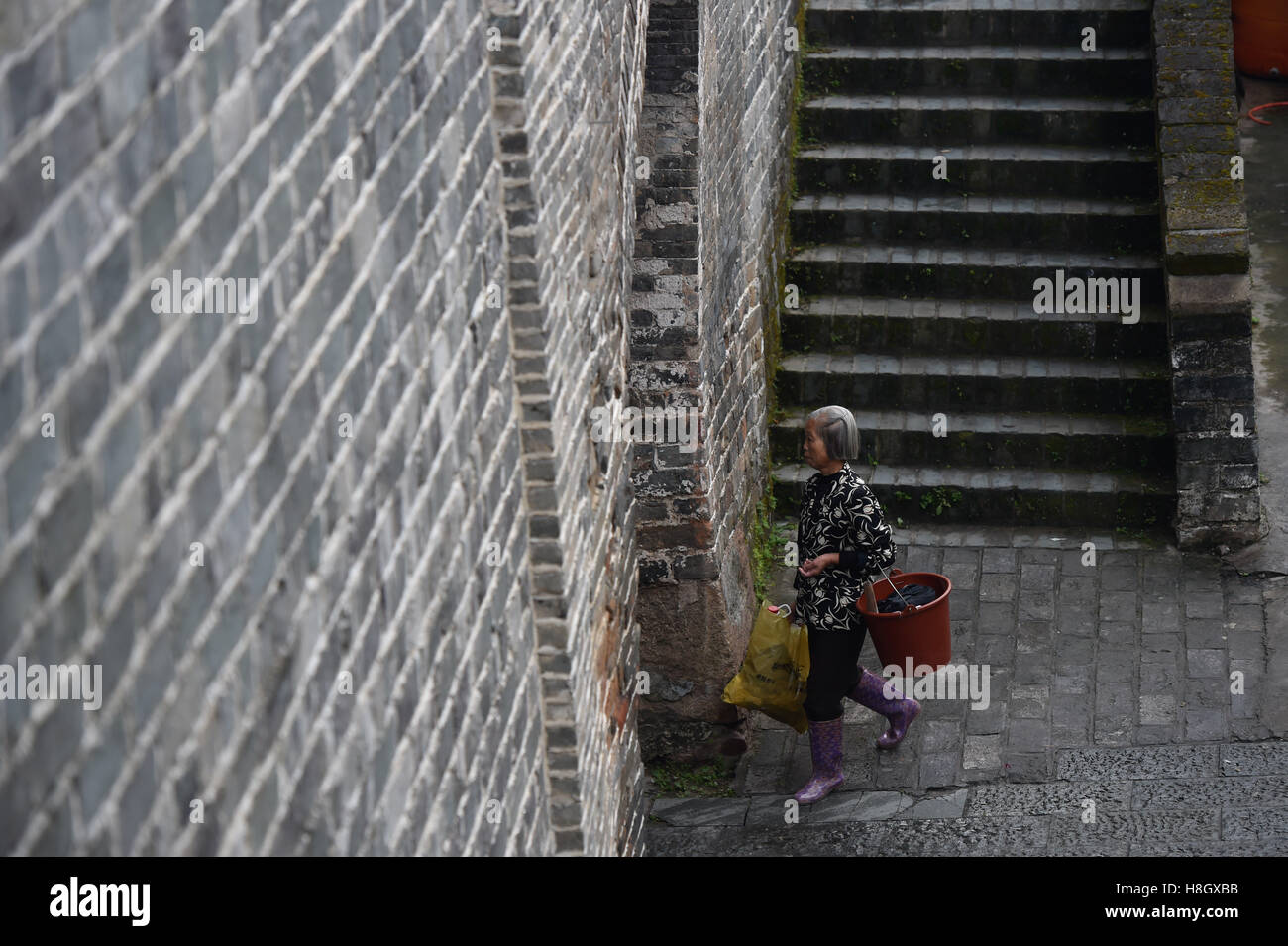 Changting, China's Fujian Province. 13th Nov, 2016. A woman walks past ...