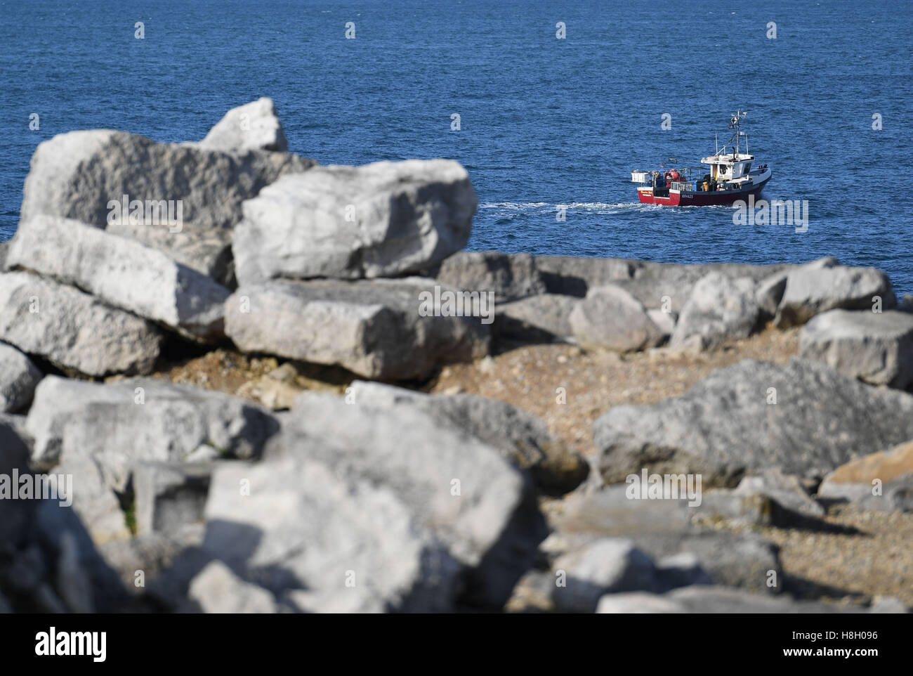 Portland, Dorset, UK. 13th Nov, 2016. Fishing trawler passes Pulpit ...