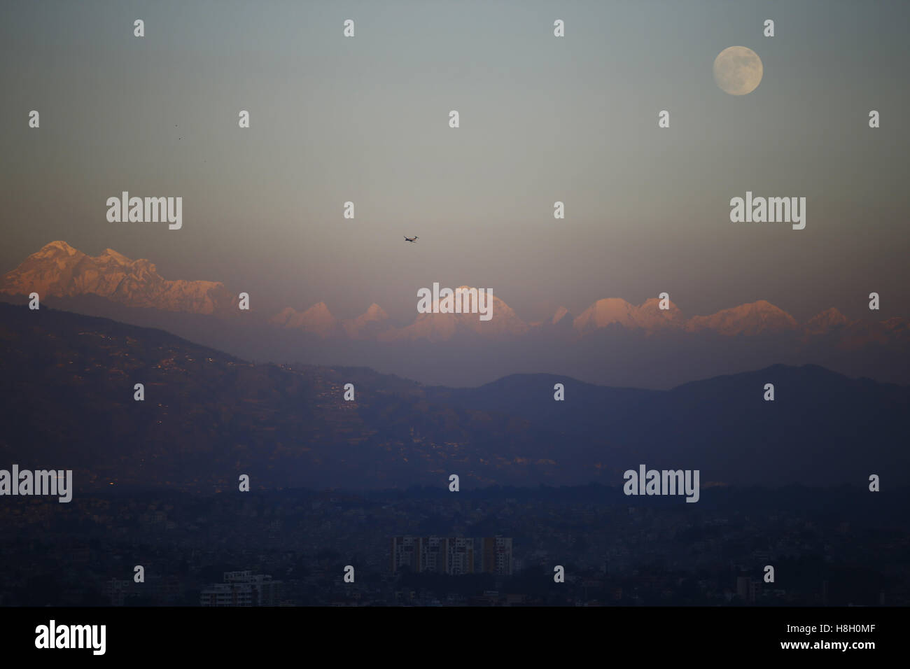 Kathmandu, Nepal. 13th Nov, 2016. Light illuminates a mountain range as ...