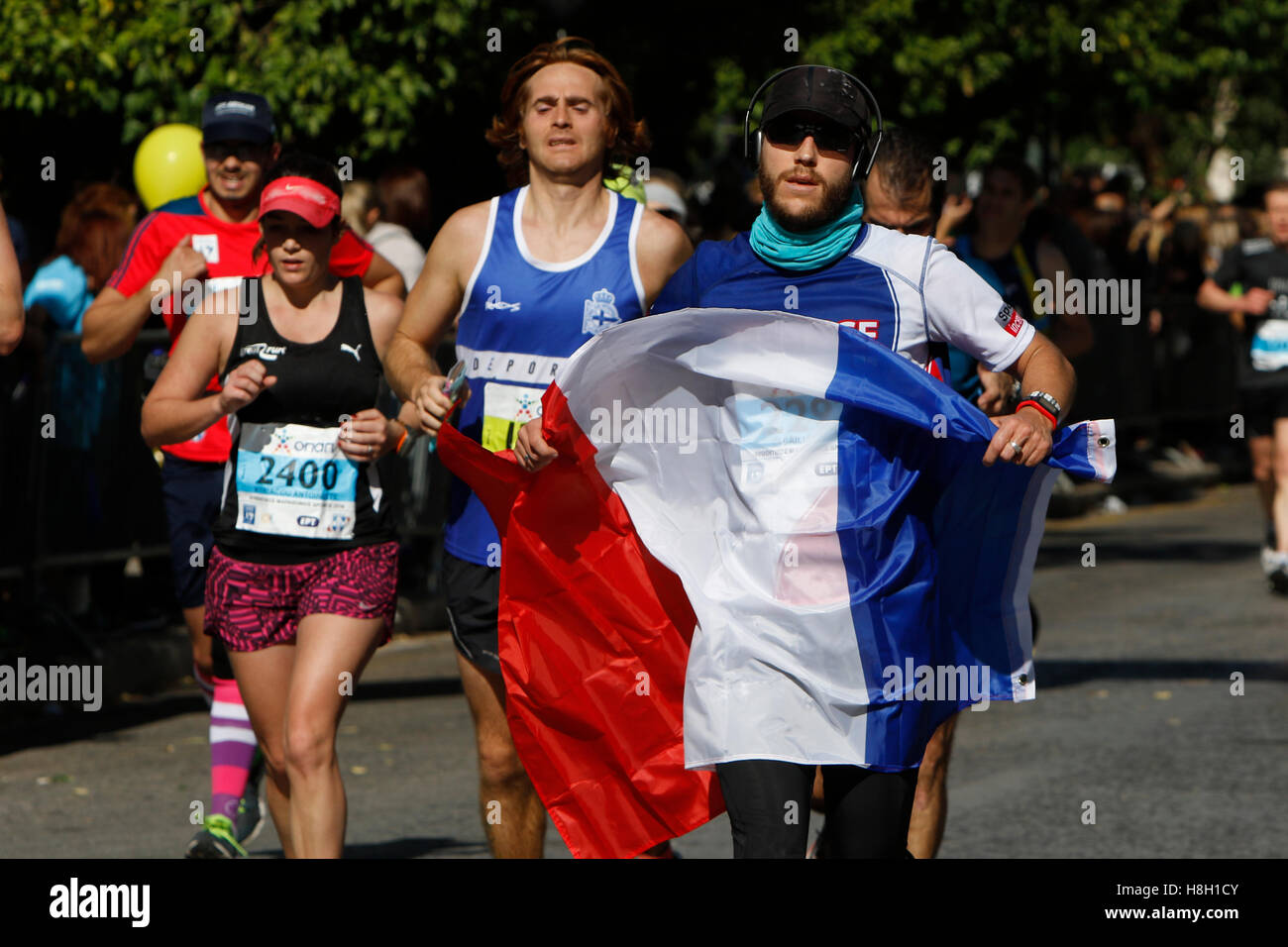 Athens, Greece. 13th November 2016. A runner carries a French flag ...