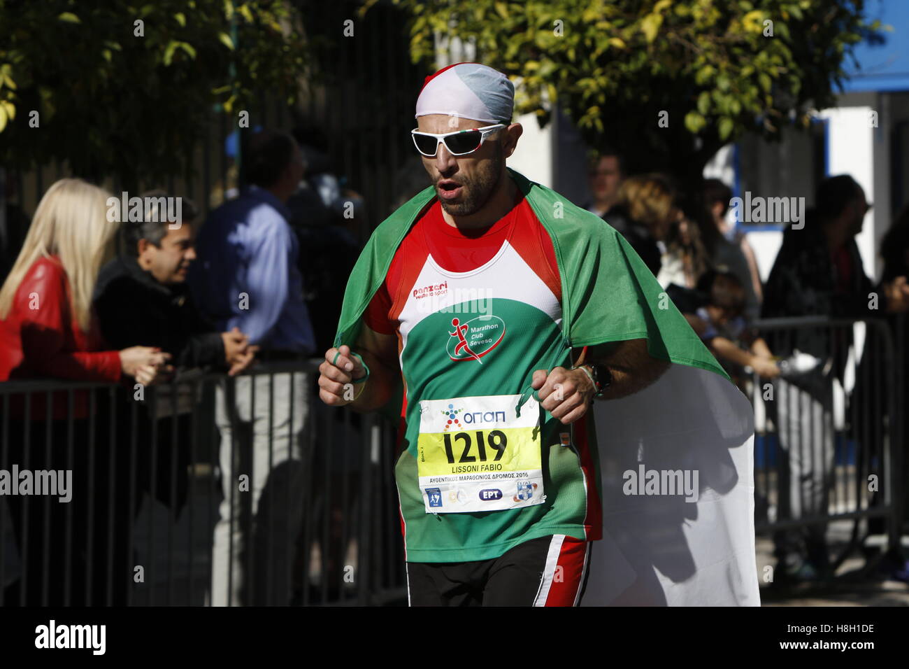 Athens, Greece. 13th November 2016. A runner is wrapped in an Italian ...