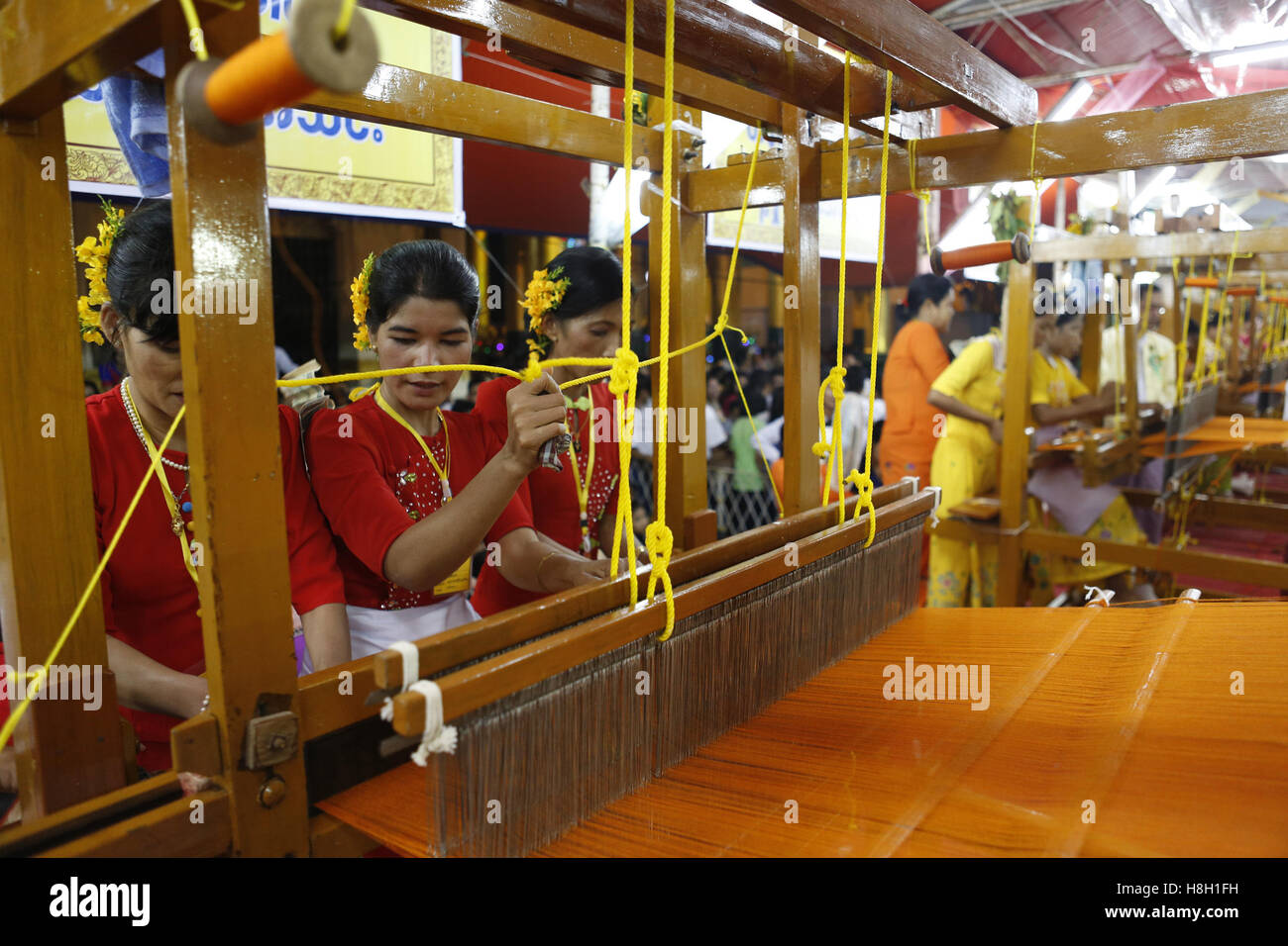 Yangon, Myanmar. 13th Nov, 2016. Women compete weaving robes at ...