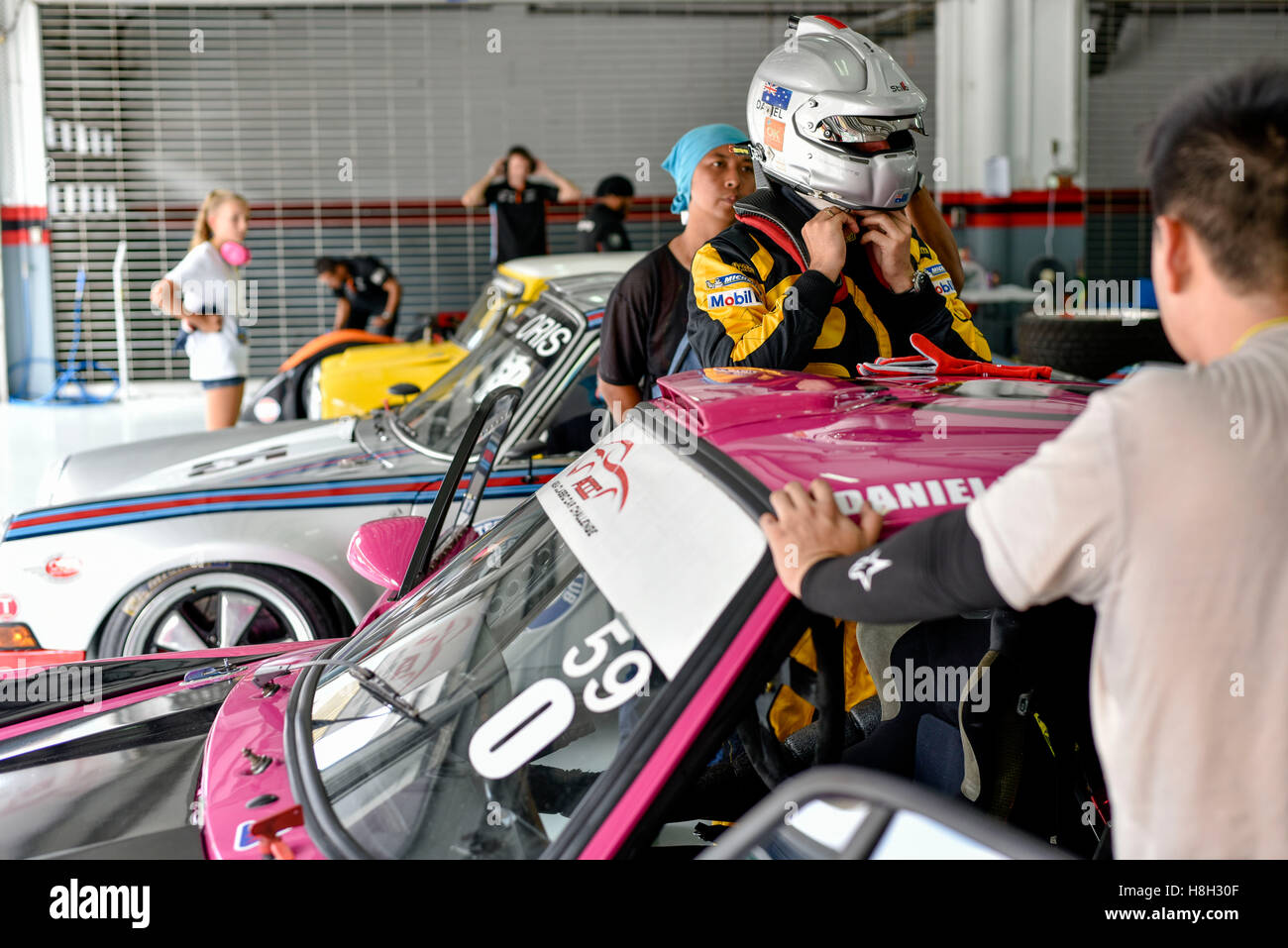 Cars line up in the paddock for pre-race inspection prior to qualifying ...