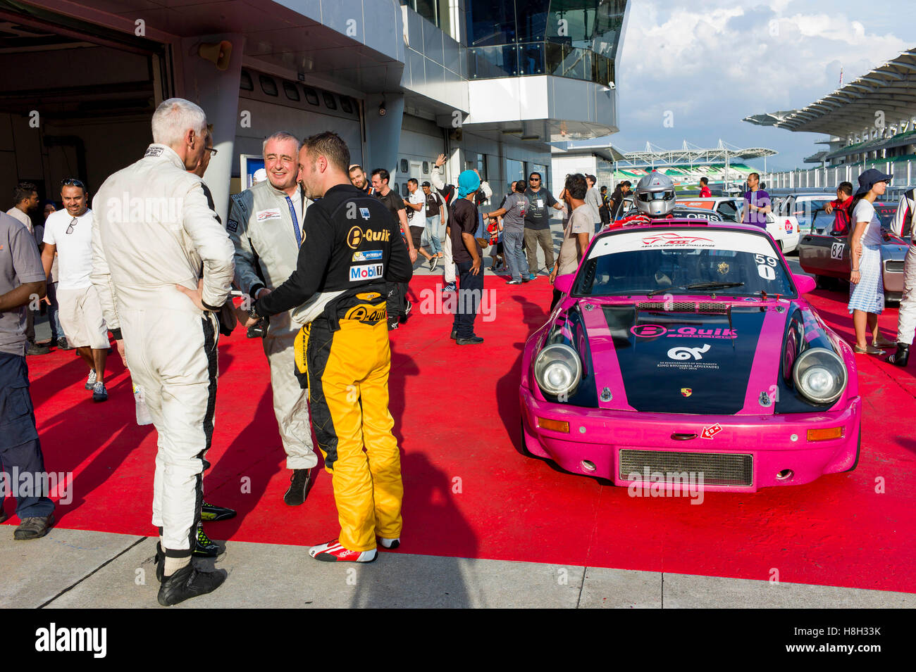 Participants celebrate at the end of the Classic car race during the ...