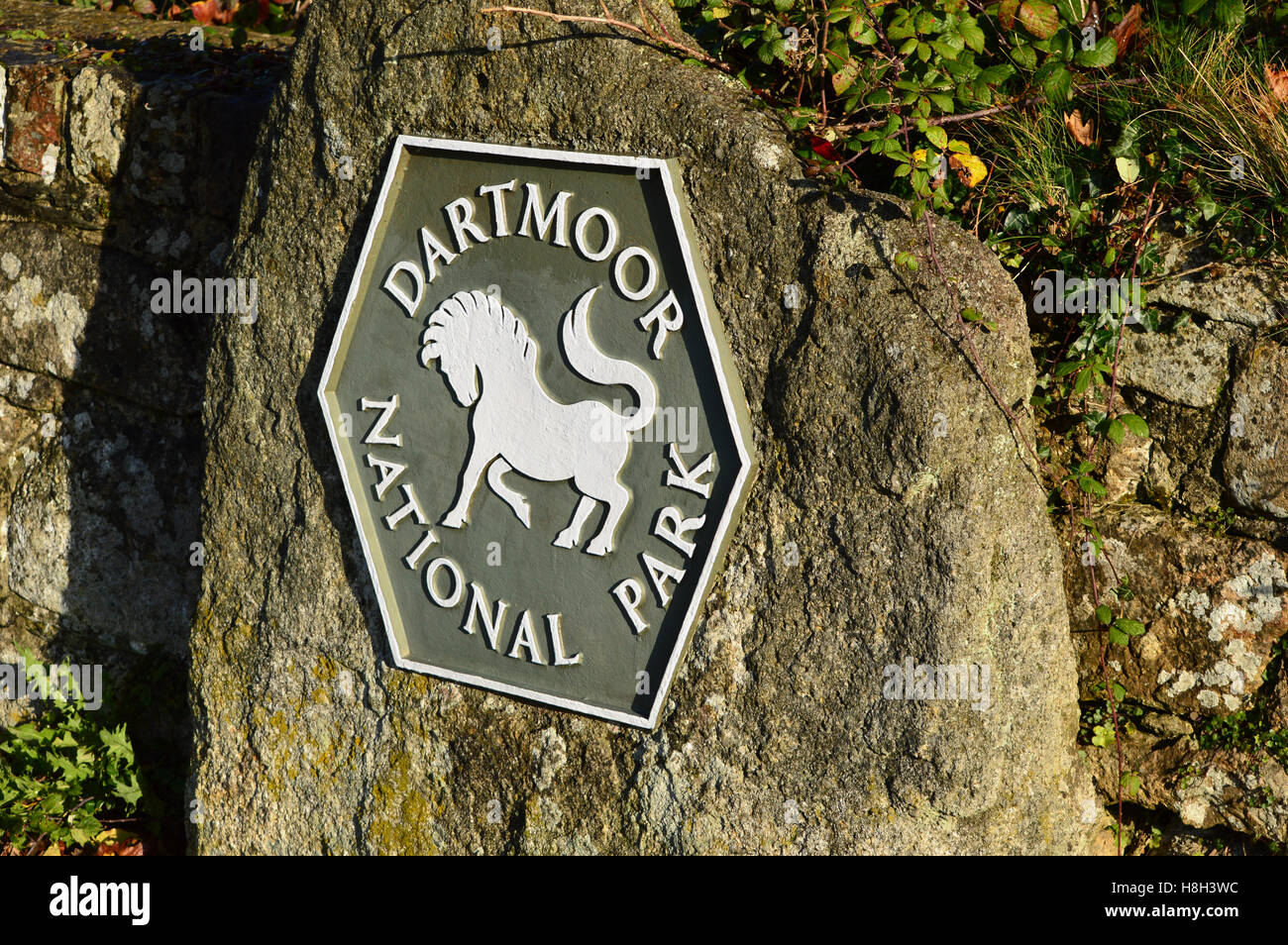 Sign showing the path to Dartmoor National Park, on old Devon Stone ...
