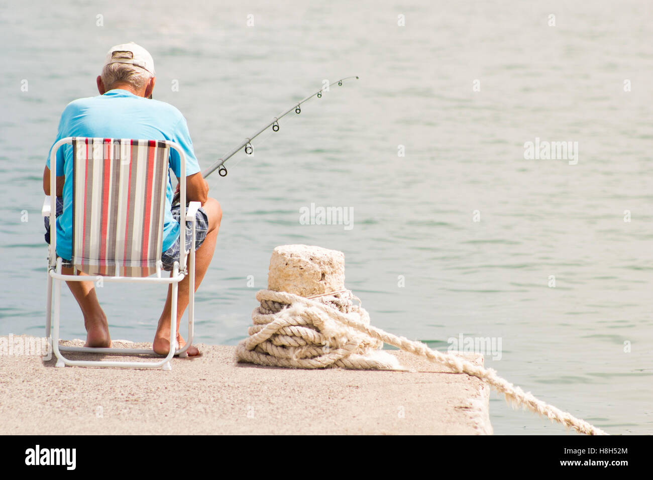 Fishing on dock in hi-res stock photography and images - Alamy