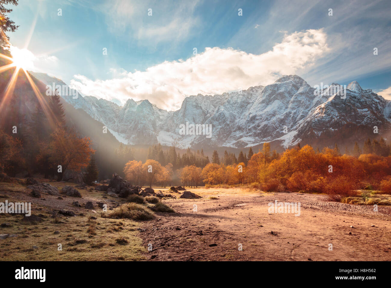 sun rise behind the peak in a colorful autumn morning Stock Photo - Alamy