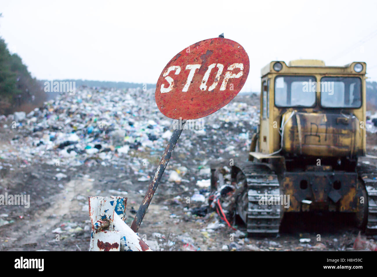 Red round stop sign, indicating that garbage at this dump has long ...