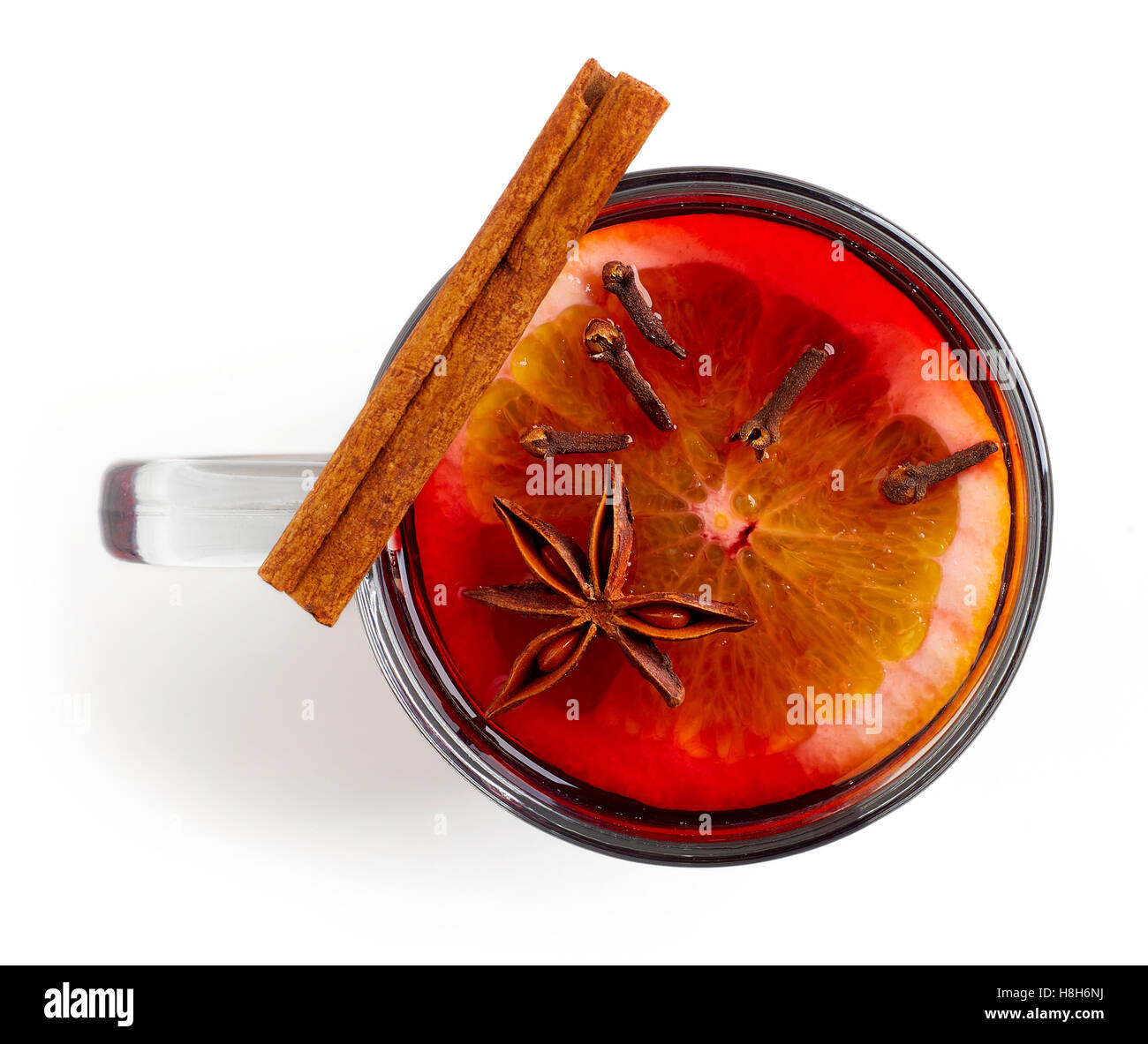 Hot red mulled wine with orange slice and christmas spices isolated on ...