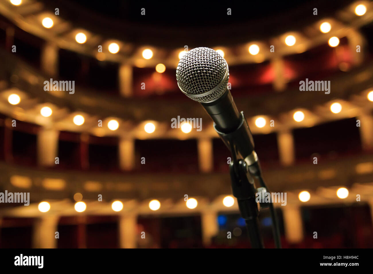 Microphone closeup in concert hall Stock Photo - Alamy