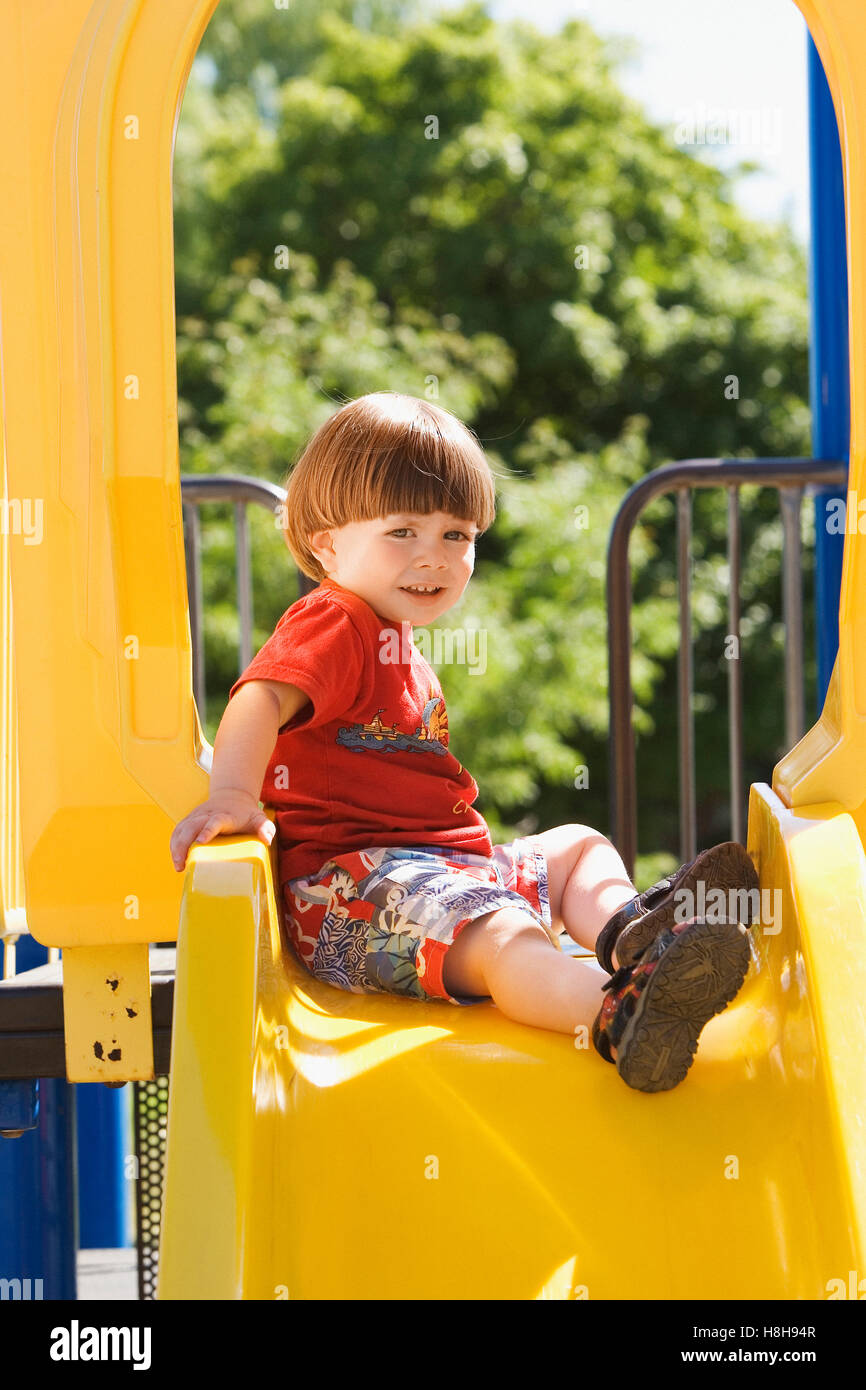 Young boy at playground Stock Photo - Alamy