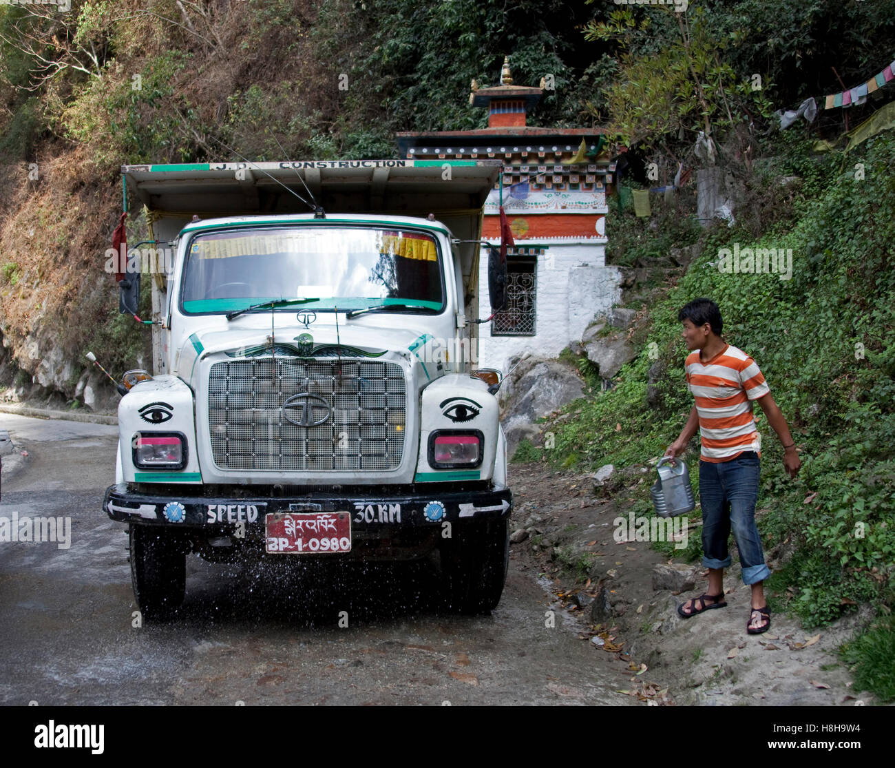 Decorated colourful heavy goods lorry TATA in mountain road, Bhutan ...