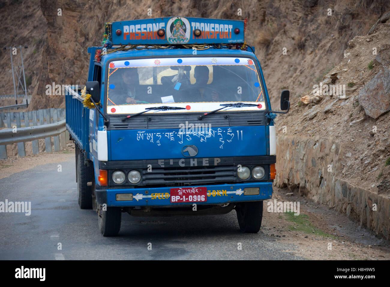 Decorated colourful heavy goods lorry TATA in mountain road, Bhutan ...