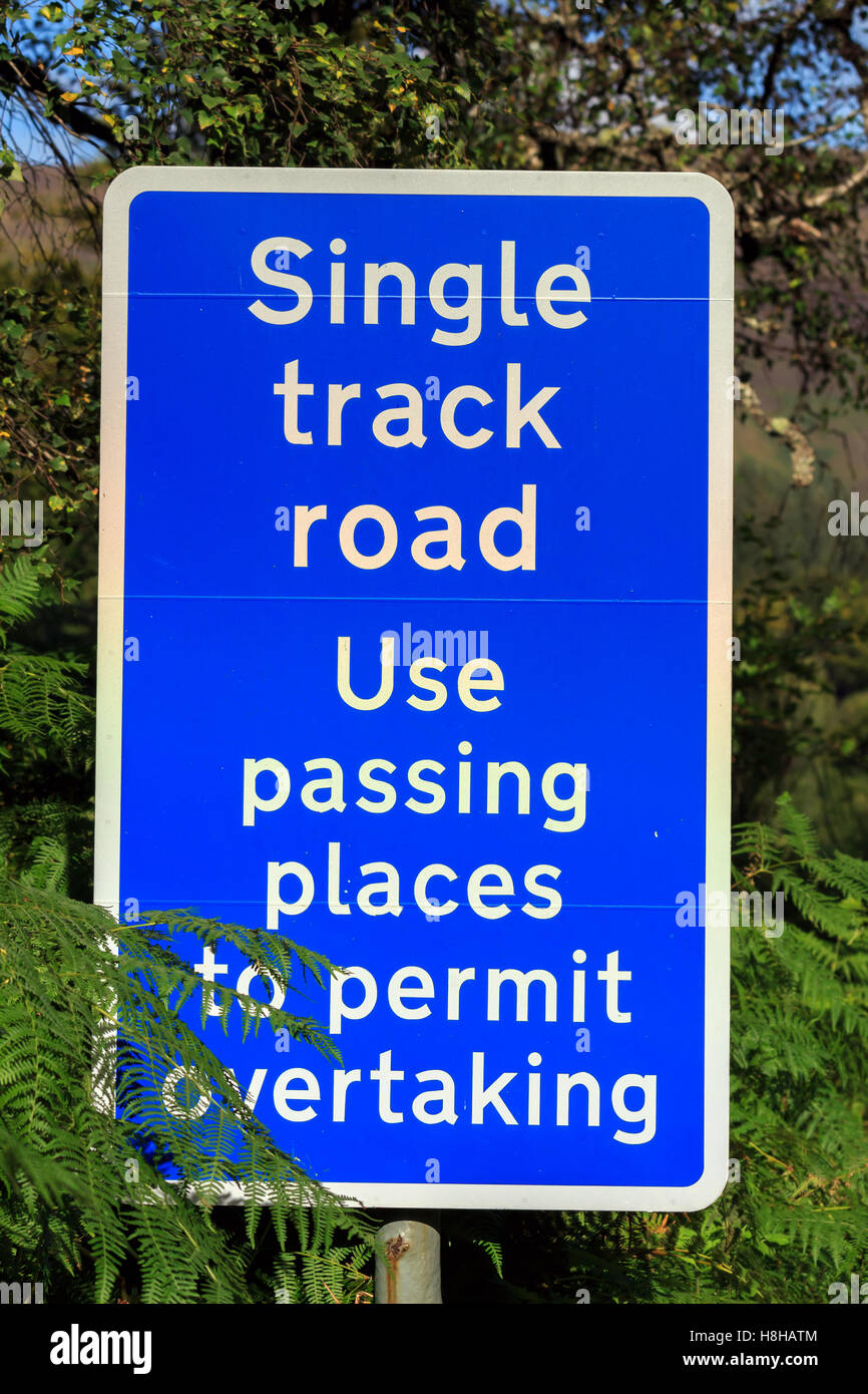 Road traffic sign advising Single Track Road, use passing places to ...