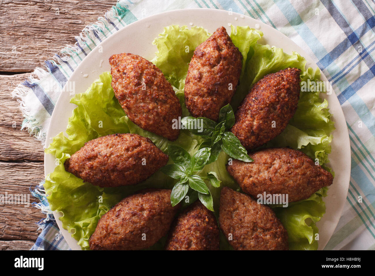 Arabic beef meatballs kibbeh close-up on a plate. horizontal view from ...