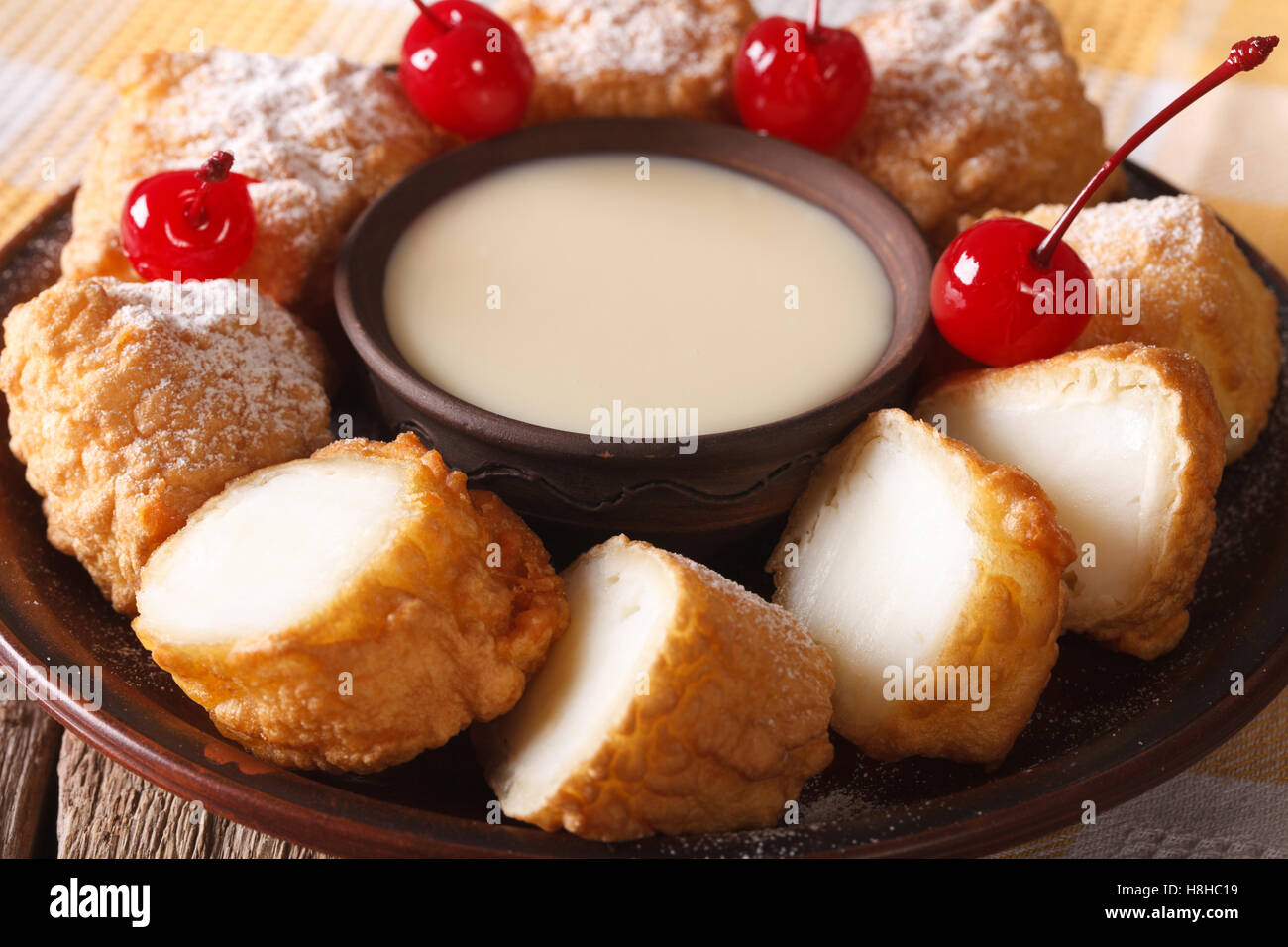 Fried milk dessert with condensed milk close-up on a plate. horizontal ...